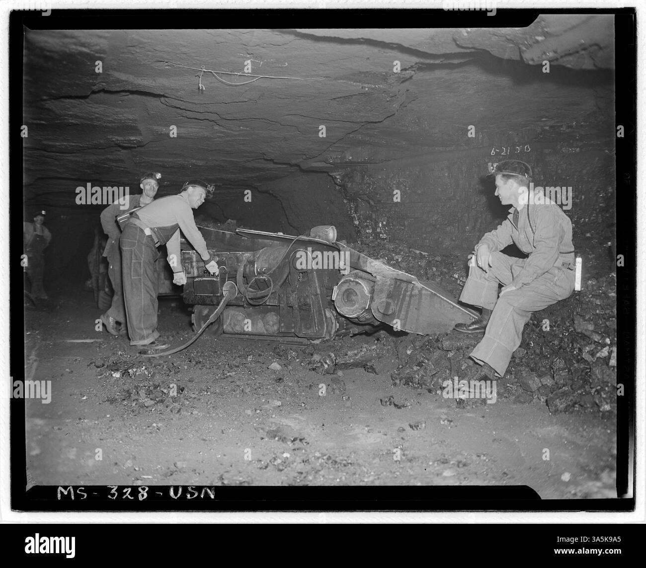 Commander J. M. Amberson operates a mechanical coal loader at Pyramid ...