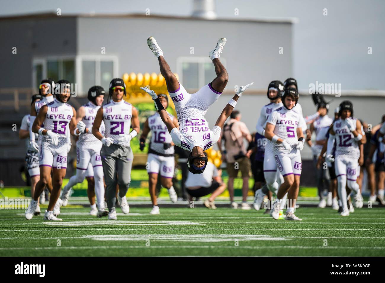 Level 82's Cade Cooper does a back flip while coming onto the football ...