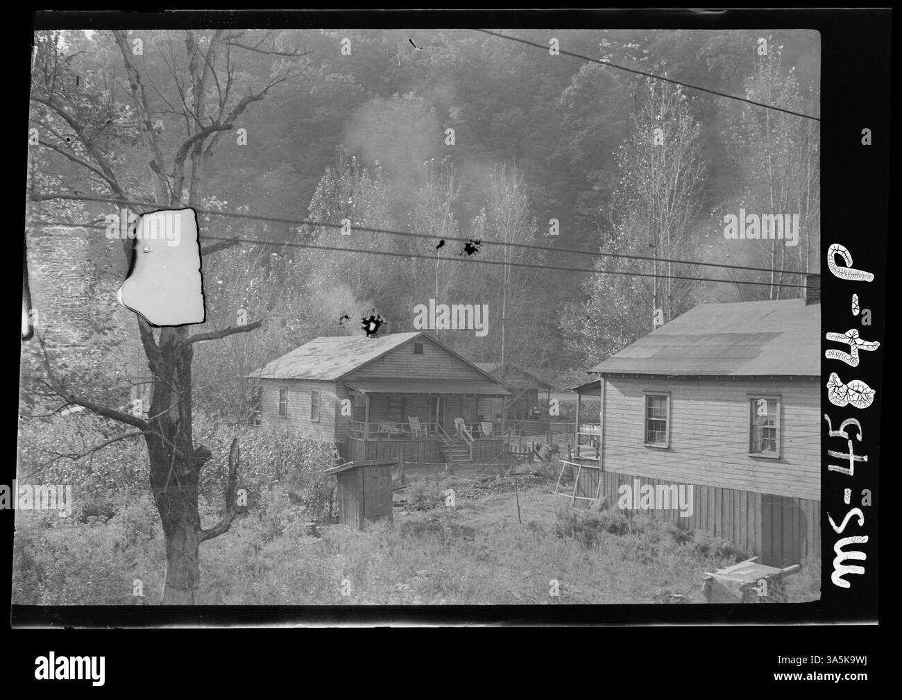 This 1946 photograph shows a privy and house at Blue Diamond Coal ...