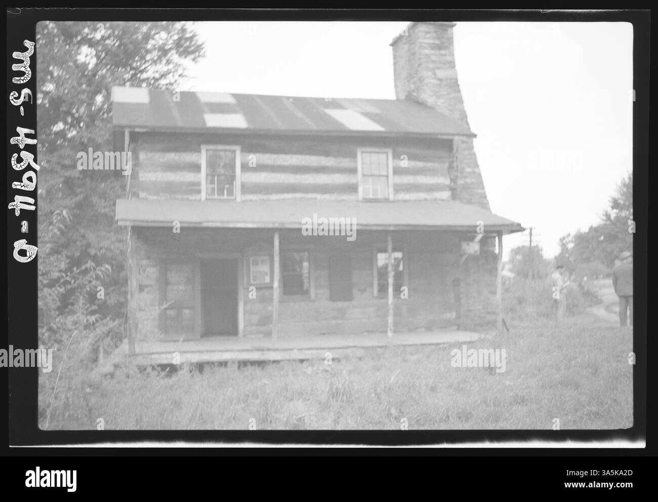 A log house, said to be over a century old, is now used as an office by ...