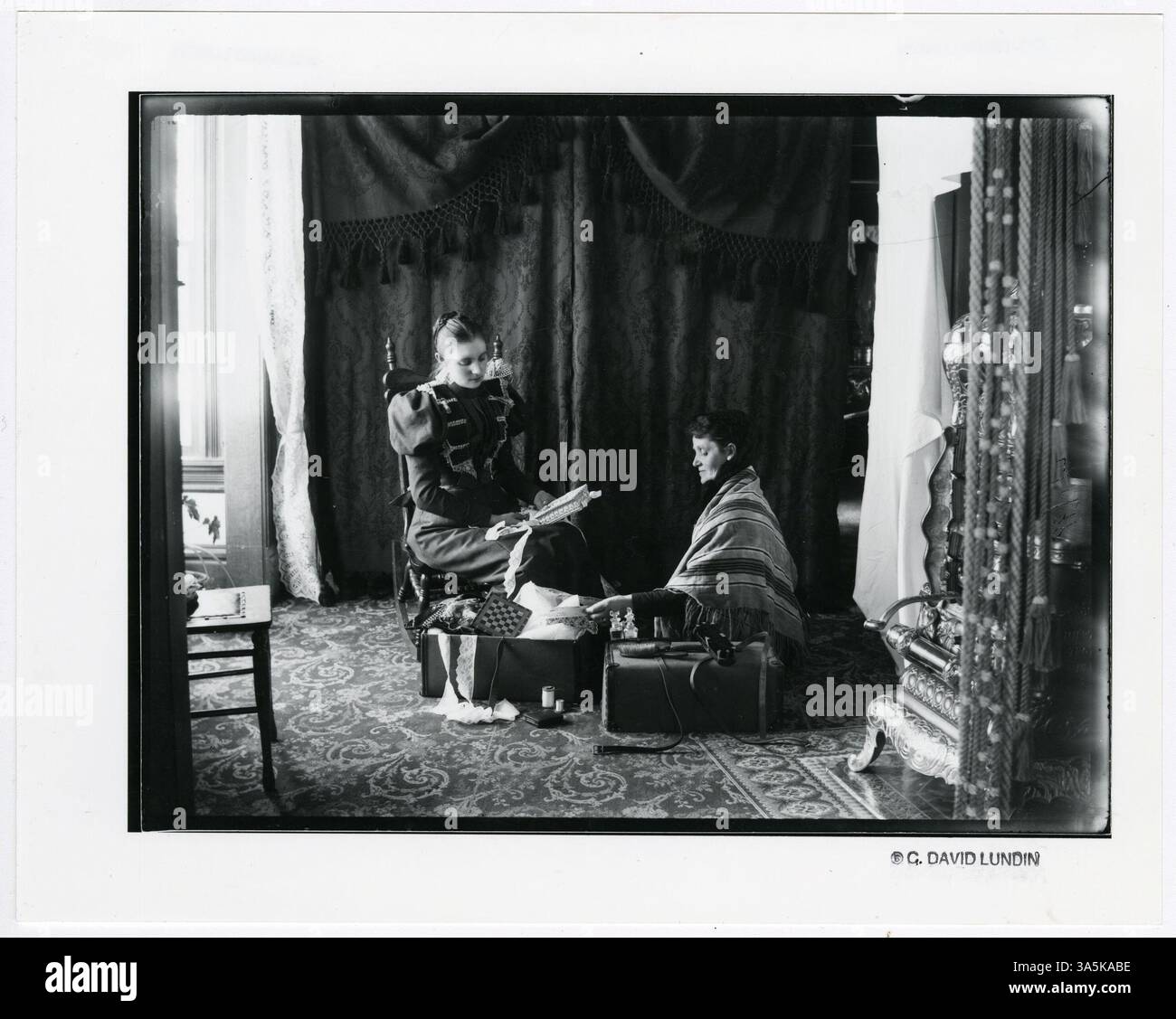 Mrs. Gustaf Erickson and her daughter Elizabeth Holcombe sorting ...