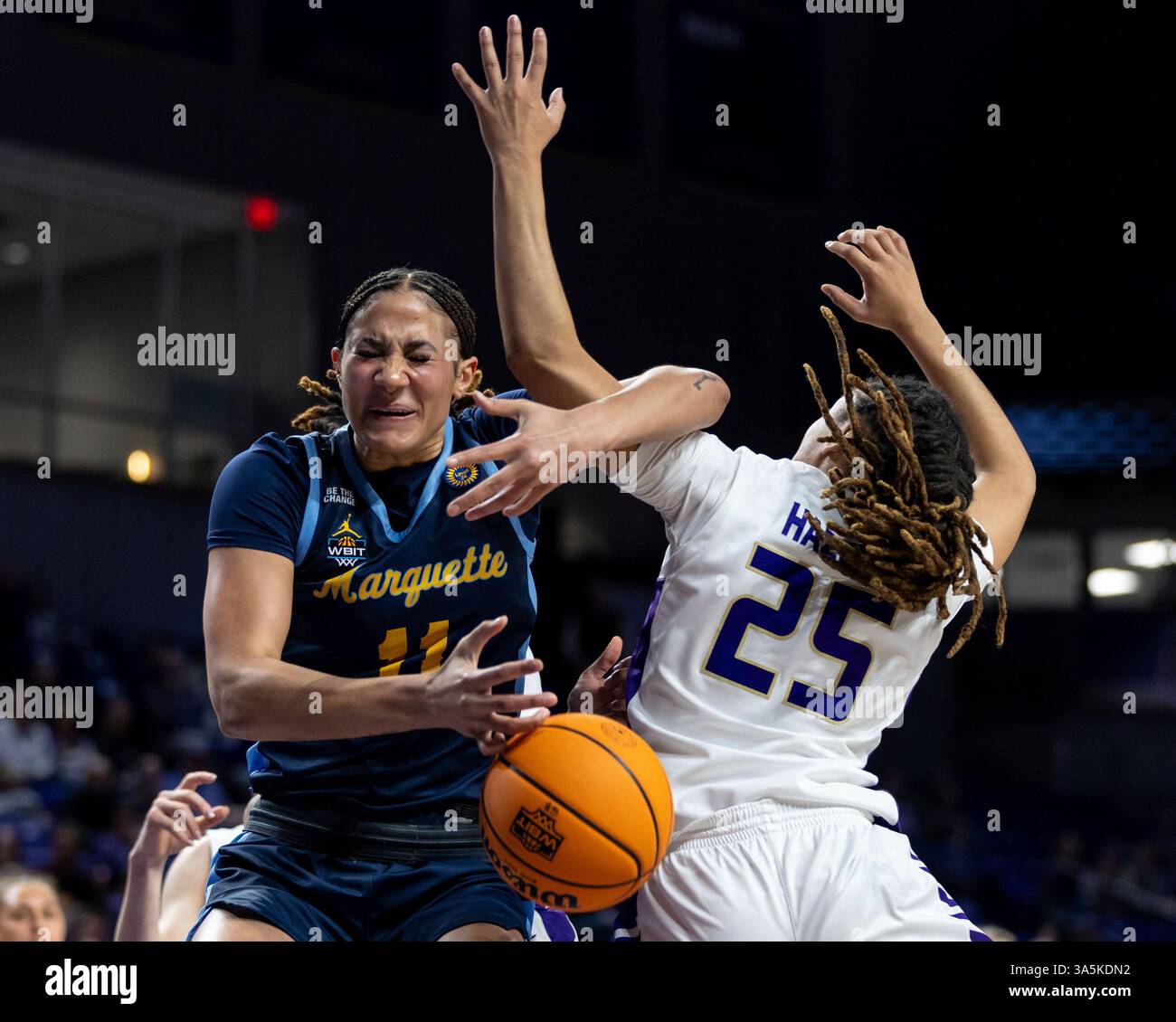 Marquette forward Skylar Forbes (11) gets tangled up with James Madison ...