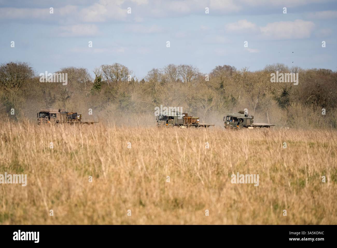 convoy of British army MAN SV HX trucks in action on a military ...