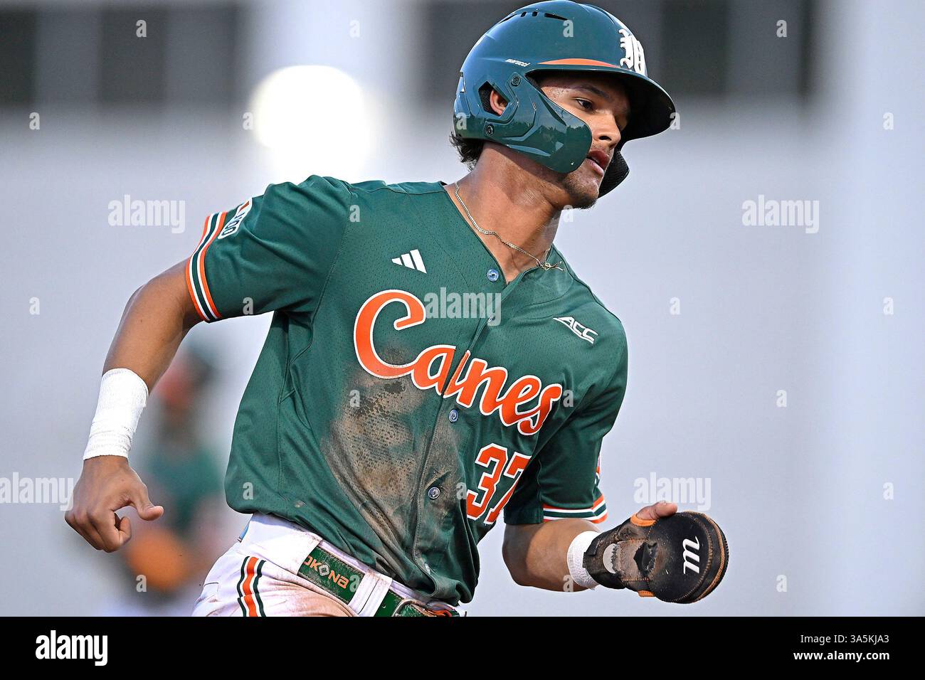 CORAL GABLES, FL - MARCH 22: Miami outfielder Fabio Peralta (37) runs ...