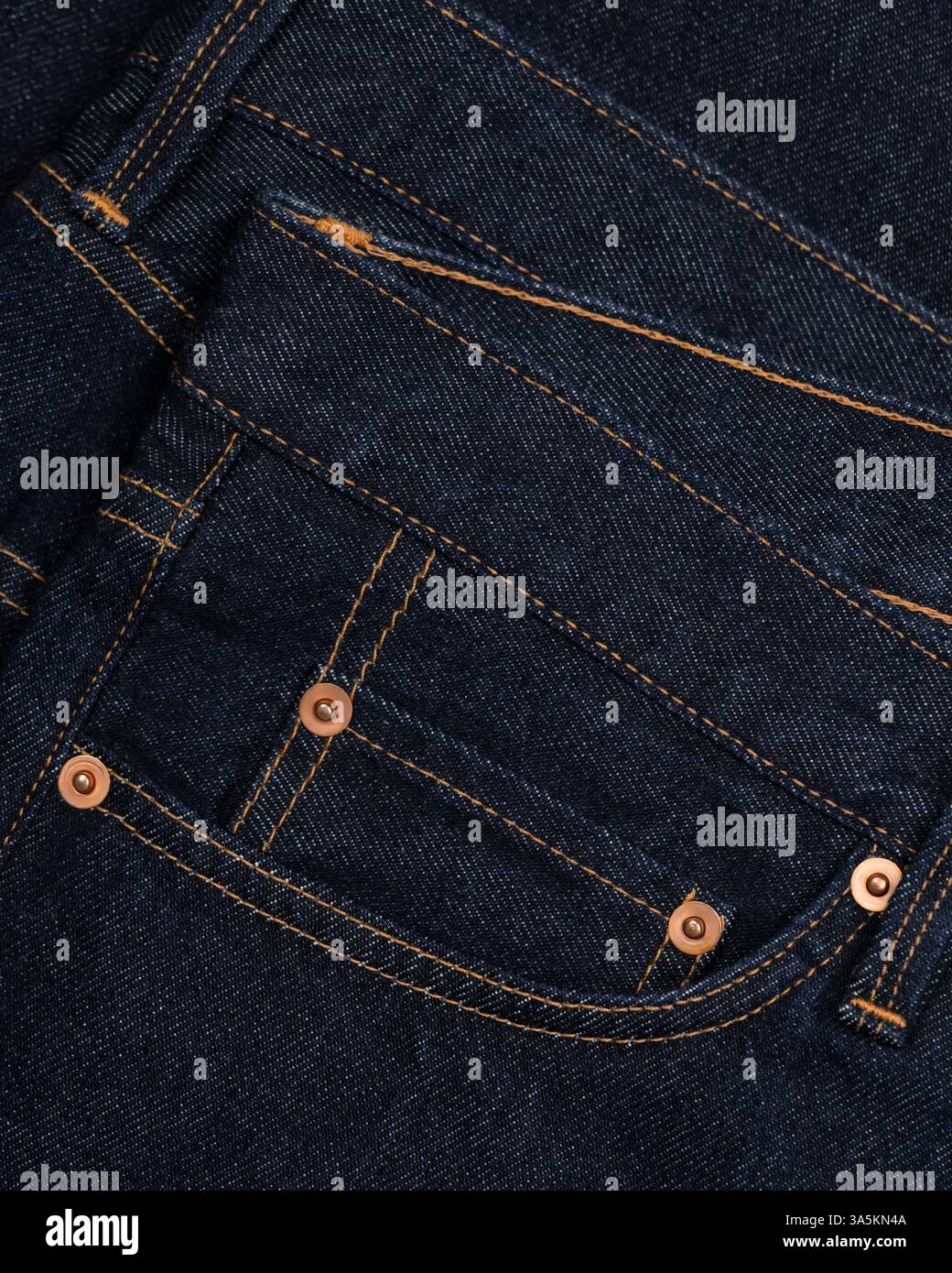 A detailed close-up of a Japanese raw denim belt in a deep indigo hue ...