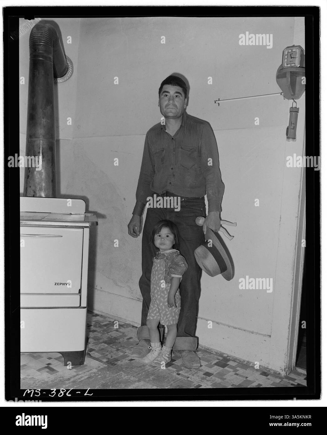 Lawrence Trujillo and his daughter are pictured in their home within ...