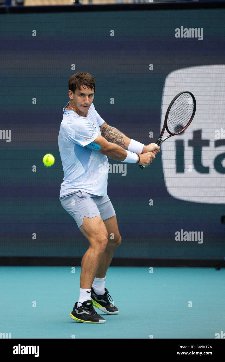 Camilo Ugo Carabelli of Argentina returns the ball during the Miami ...