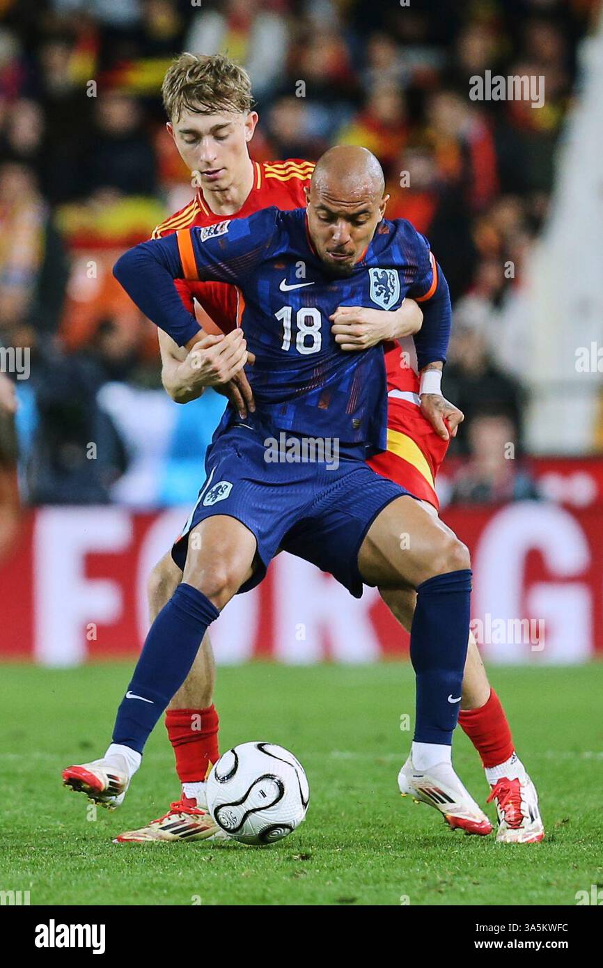Spain's Dean Huijsen, background, duels for the ball with Netherlands ...