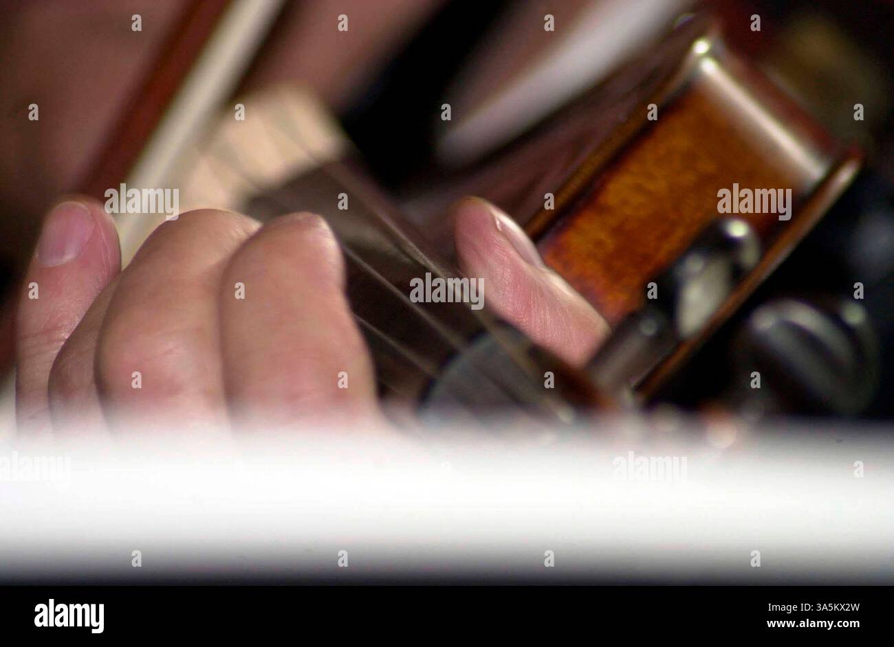 a violin, a wooden string instrument played with a bow violin, a wooden ...