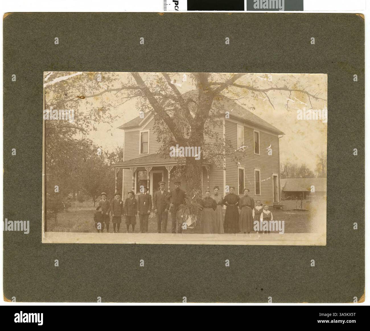 A group of thirteen individuals, seven males and six females, are ...