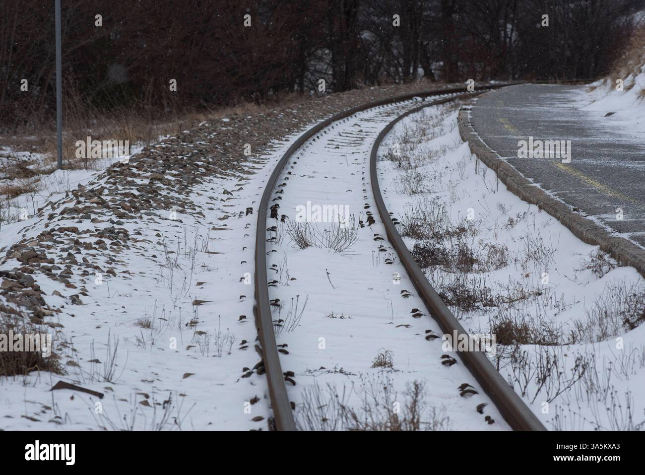 railway track system in winter, on a grey and snowy day railway track ...