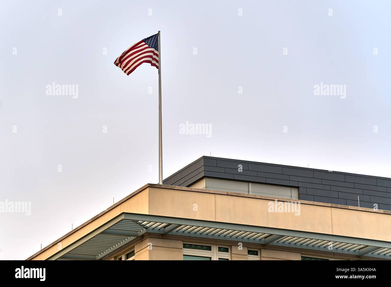 Berlin, Germany - March 23, 2025: The American flag flies on the roof ...
