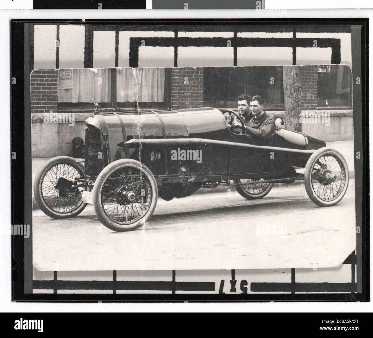 Glenn H. Allyn is seen driving a 1917 race car in Mankato, Minnesota ...