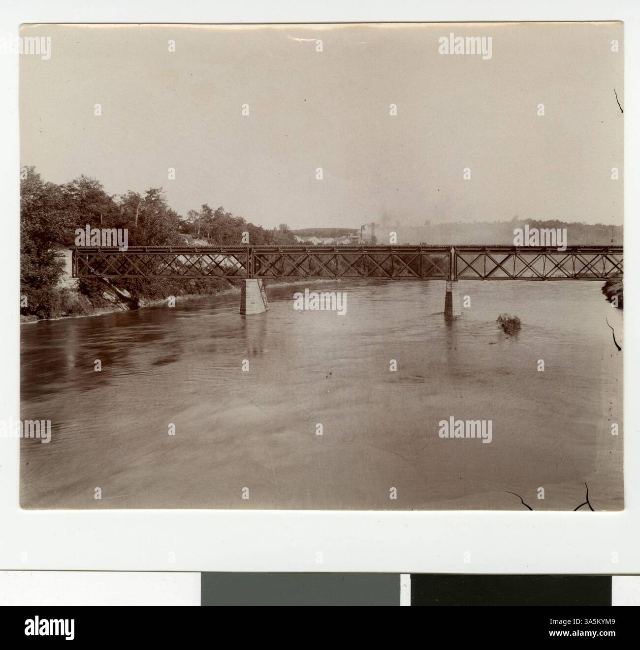 A railroad trestle in Blue Earth County, Minnesota, spans a river or ...