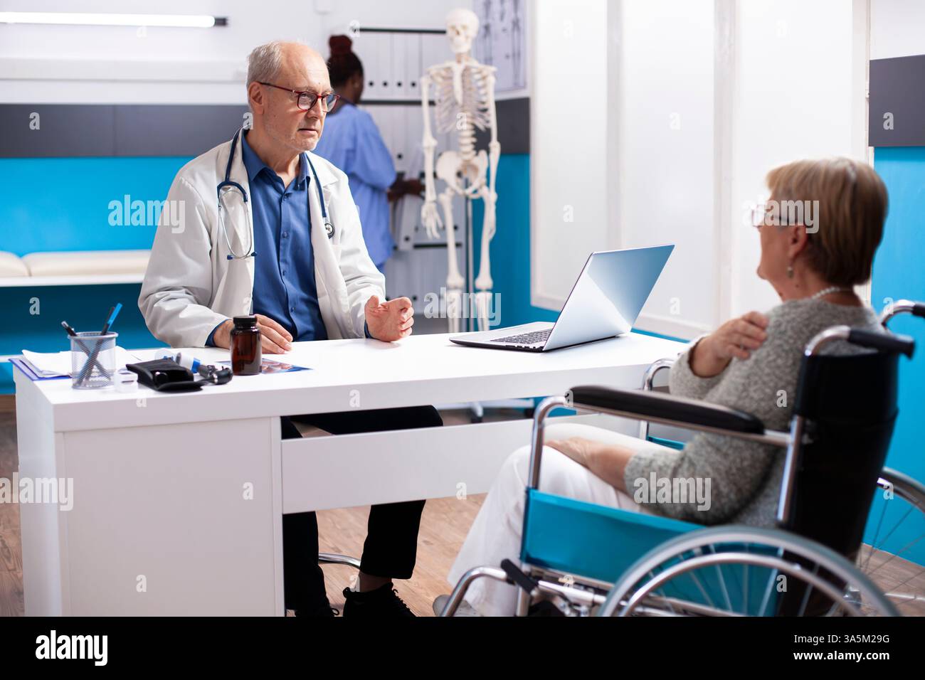 Elderly woman in wheelchair engages hi-res stock photography and images ...