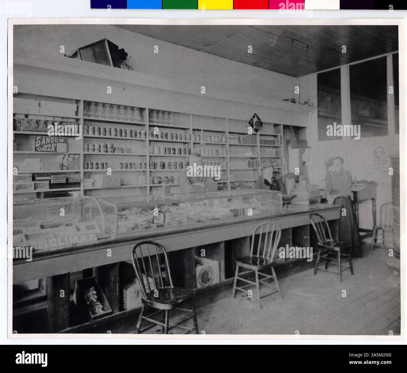 An interior view of the Berentson Store in Mankato with three people at ...