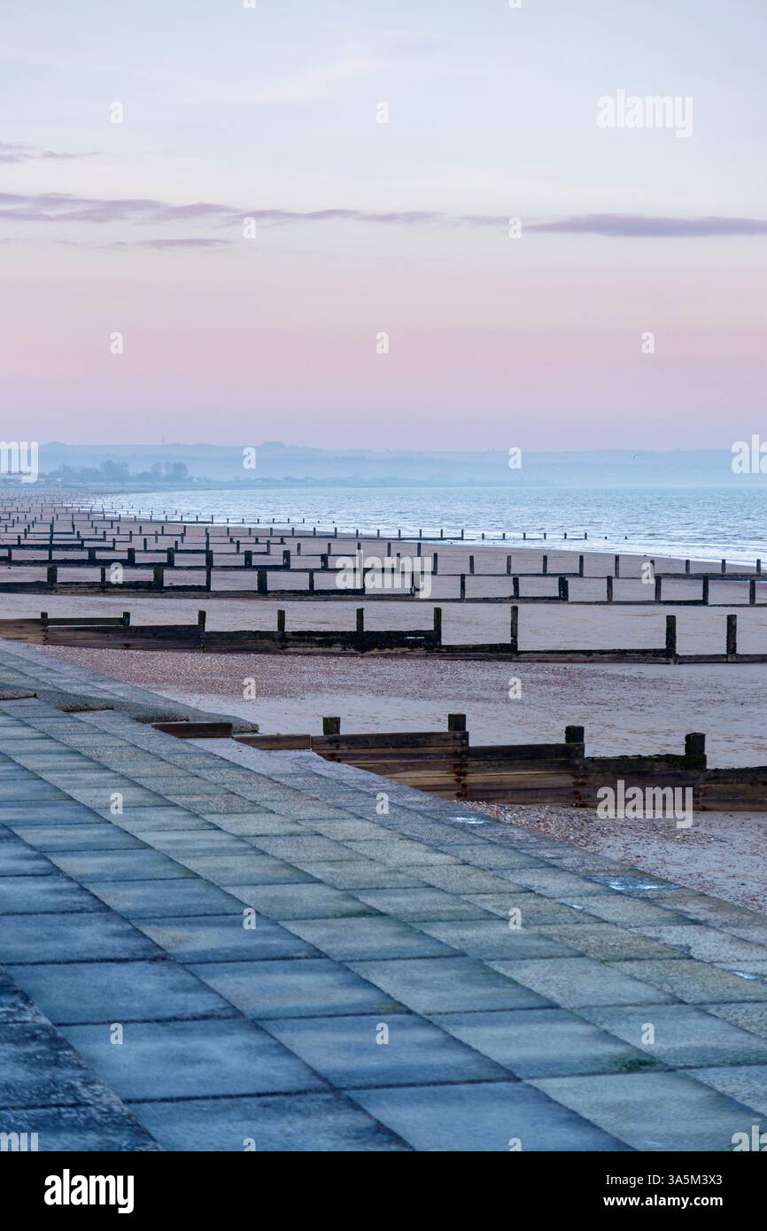 Anti-flooding groynes at Dymchurch Sae Wall along the beach in Romney ...