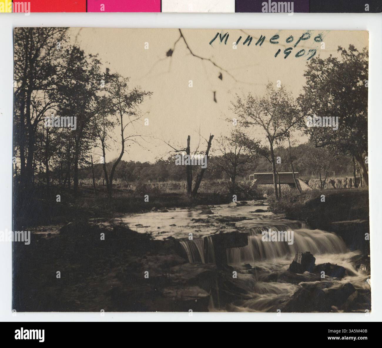 A view of the upper Minneopa Falls and the surrounding creek and bridge ...