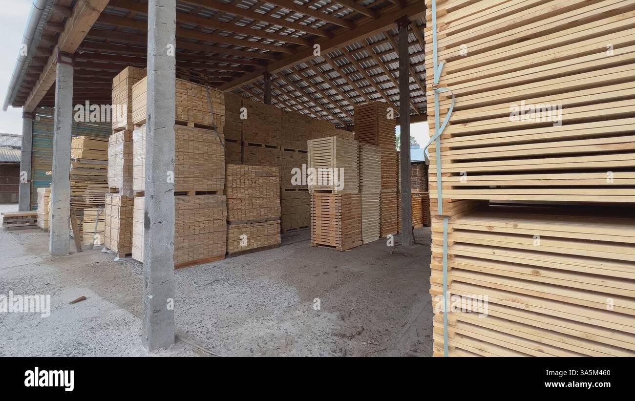 Stacks of lumber drying and seasoning in a large lumber warehouse Stock ...