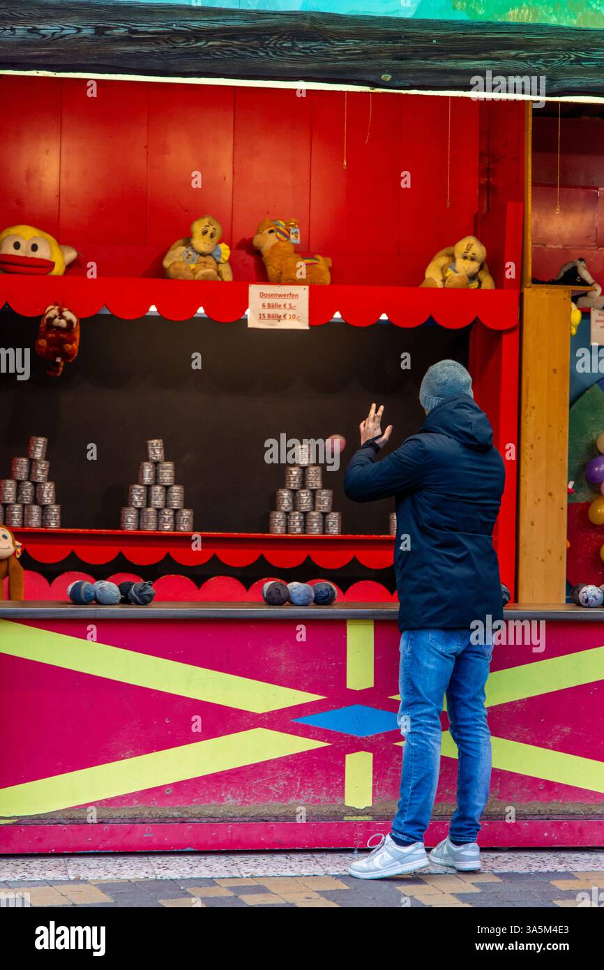 02-22-2025, Vienna, Tourist is throwing a ball, trying to knock down a ...