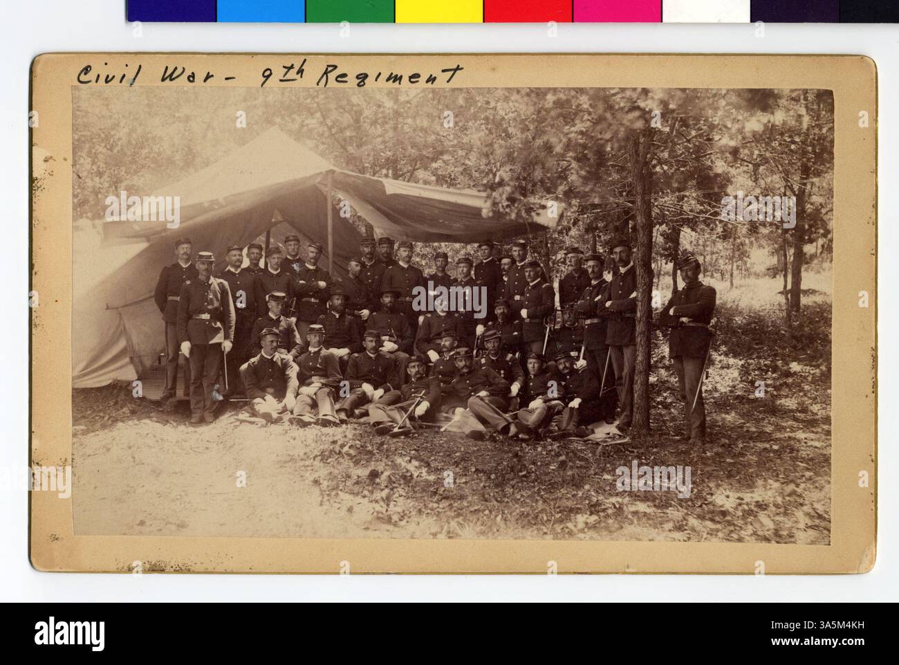 A photograph of National Guard officers in front of a tent, identified ...