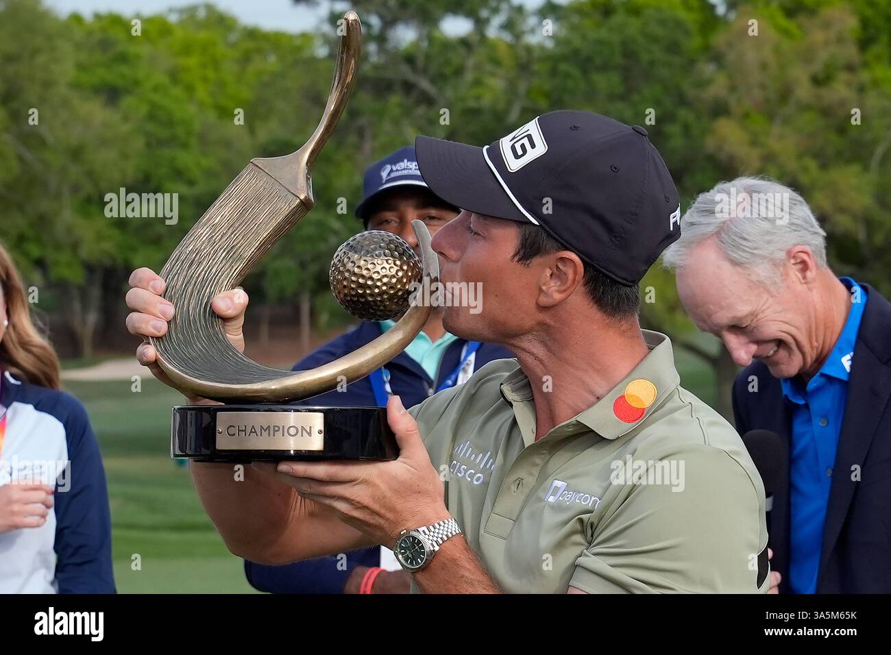 Viktor Hovland, of Norway, kisses the trophy after winning the Valspar ...