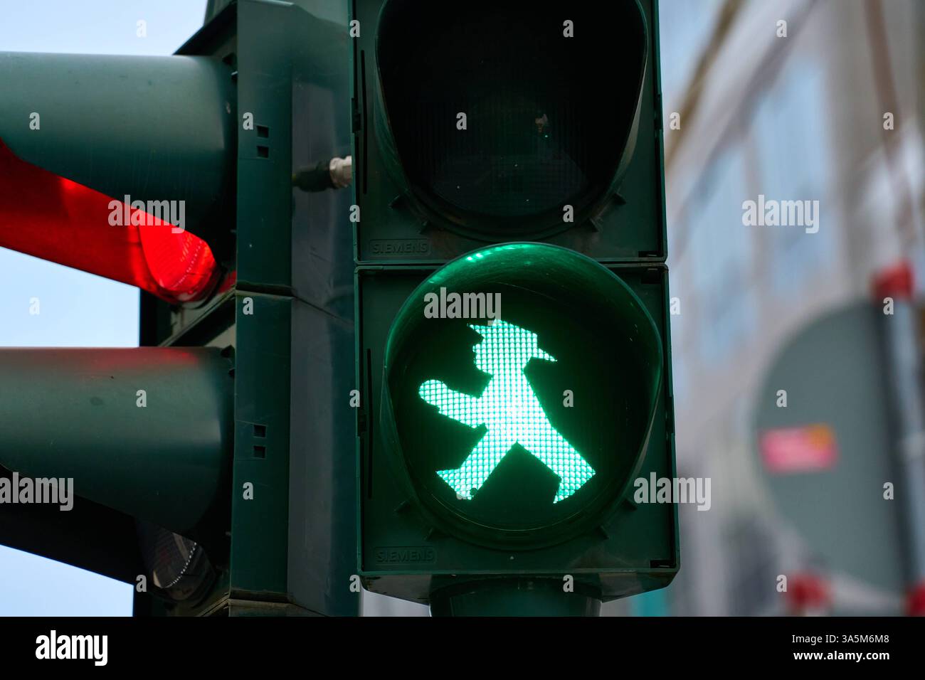 Berlin, Germany - March 23, 2025: The green traffic light man in Berlin ...