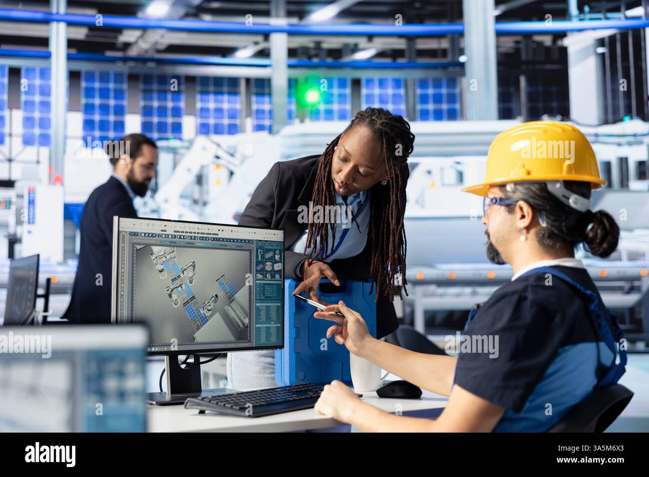 Teamworking photovoltaics factory colleagues reviewing system logs to ...