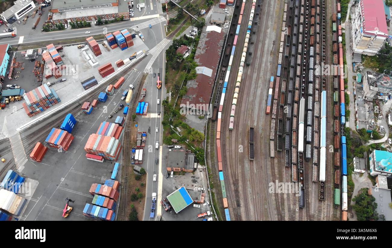 Aerial panorama revealing sprawling freight terminal with parked trains ...