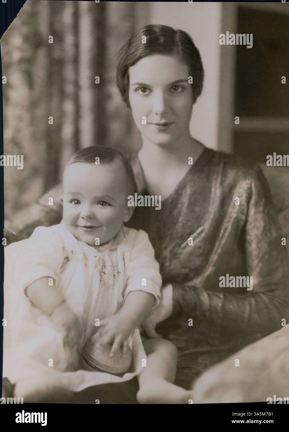 This photograph from 1927 features Mrs. William Lang and her baby ...