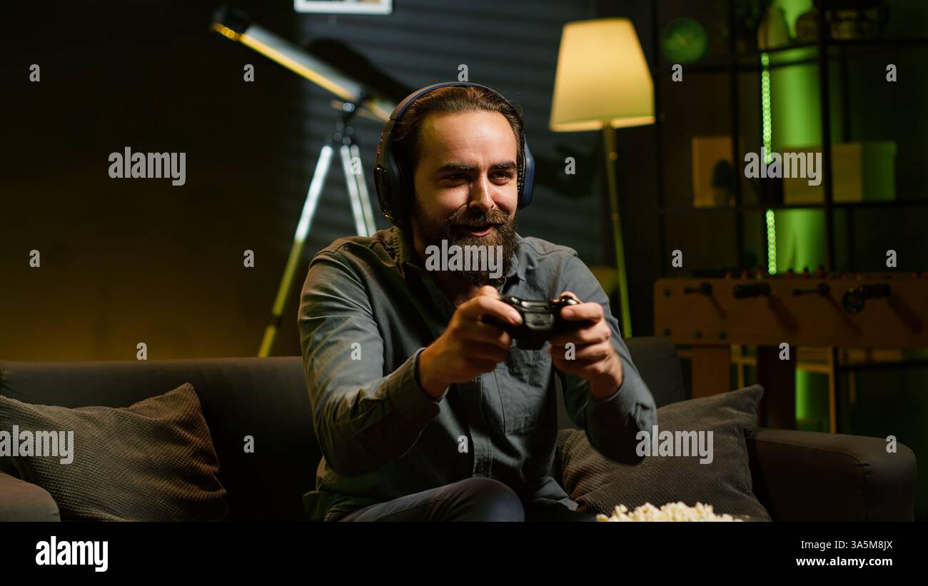 Cheerful gamer celebrating, showing positive emotions after defeating ...