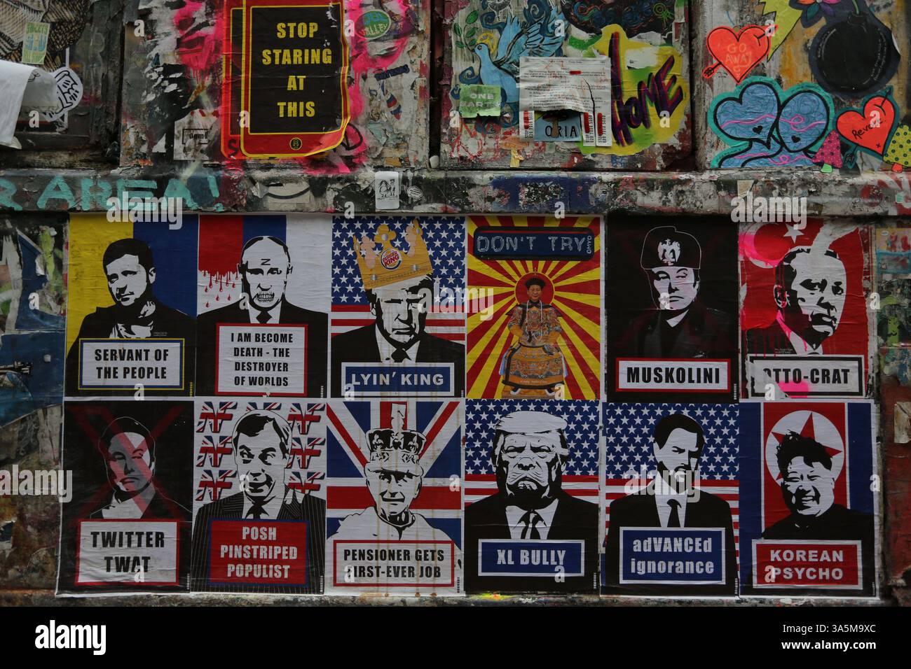 March 23, 2025, London, England, UK: Political posters adorn a wall in ...