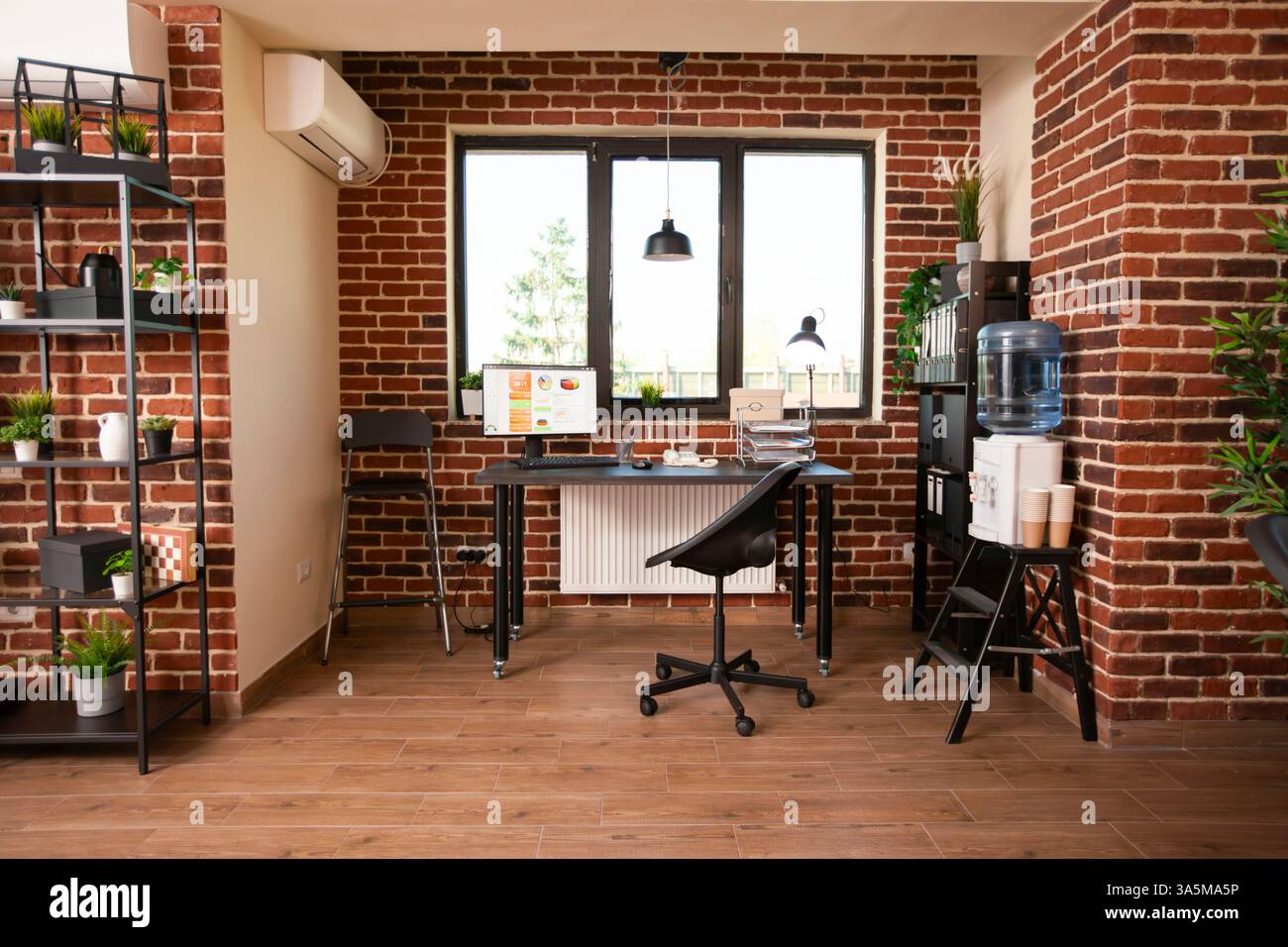 Vacant desk with desktop monitor showing financial analysis and ...
