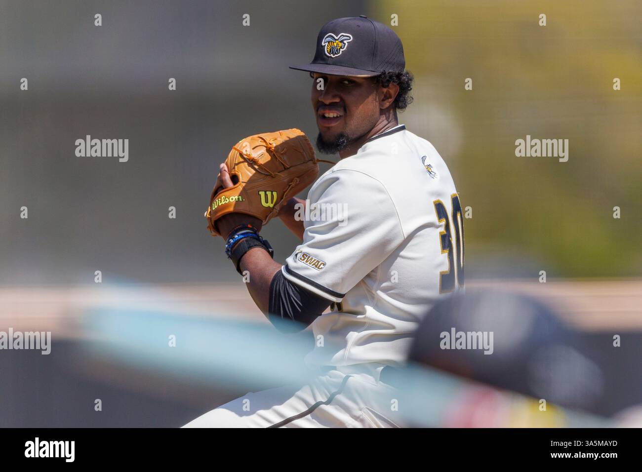 Alabama State pitcher Esaid Peña (30) pitches against Florida A&M ...