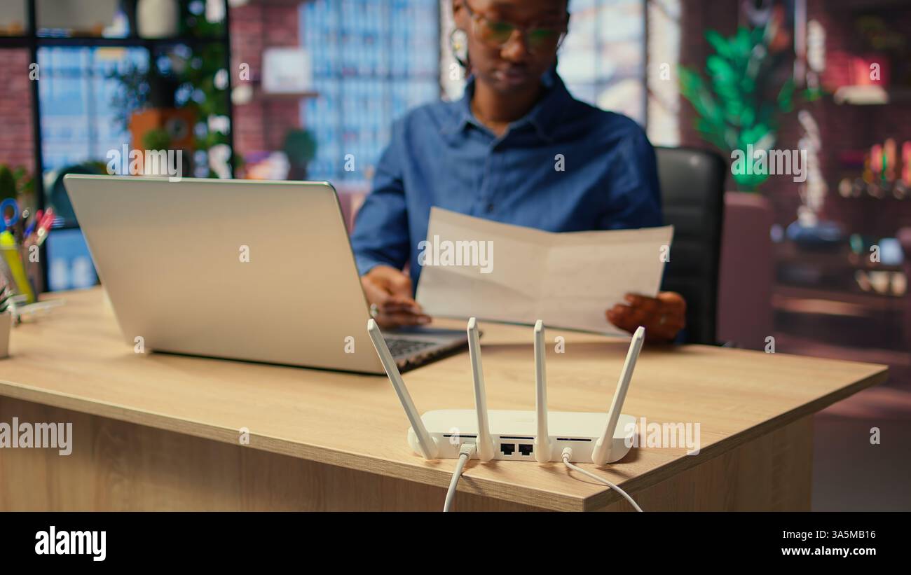 Young woman struggling with weak internet connection at home, pulling ...