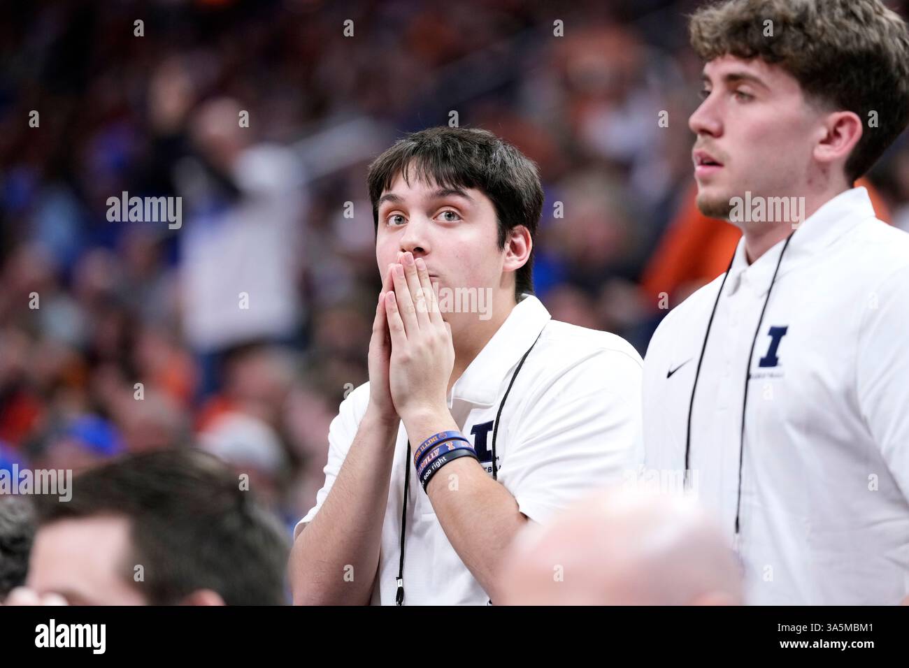 An Illinois fan reacts to a foul call during the first half in the ...