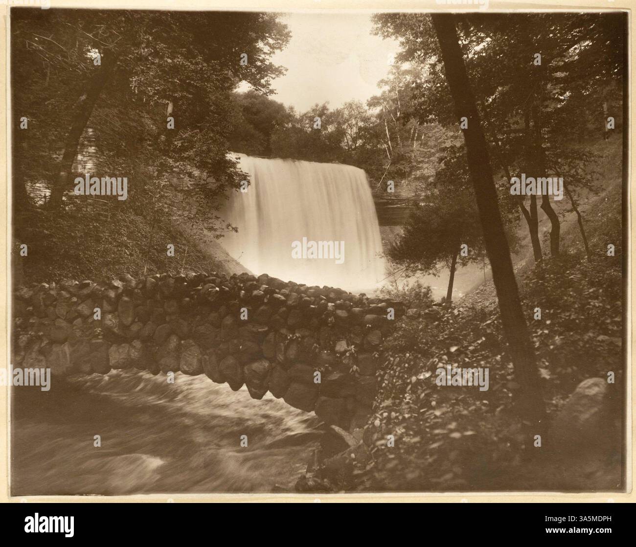 Minnehaha Falls, a popular natural landmark in Minneapolis, is depicted ...
