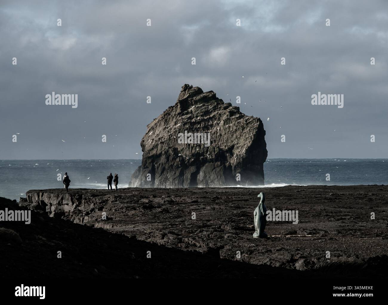A dramatic basalt sea stack rises off the coast of Valahnúkamöl ...