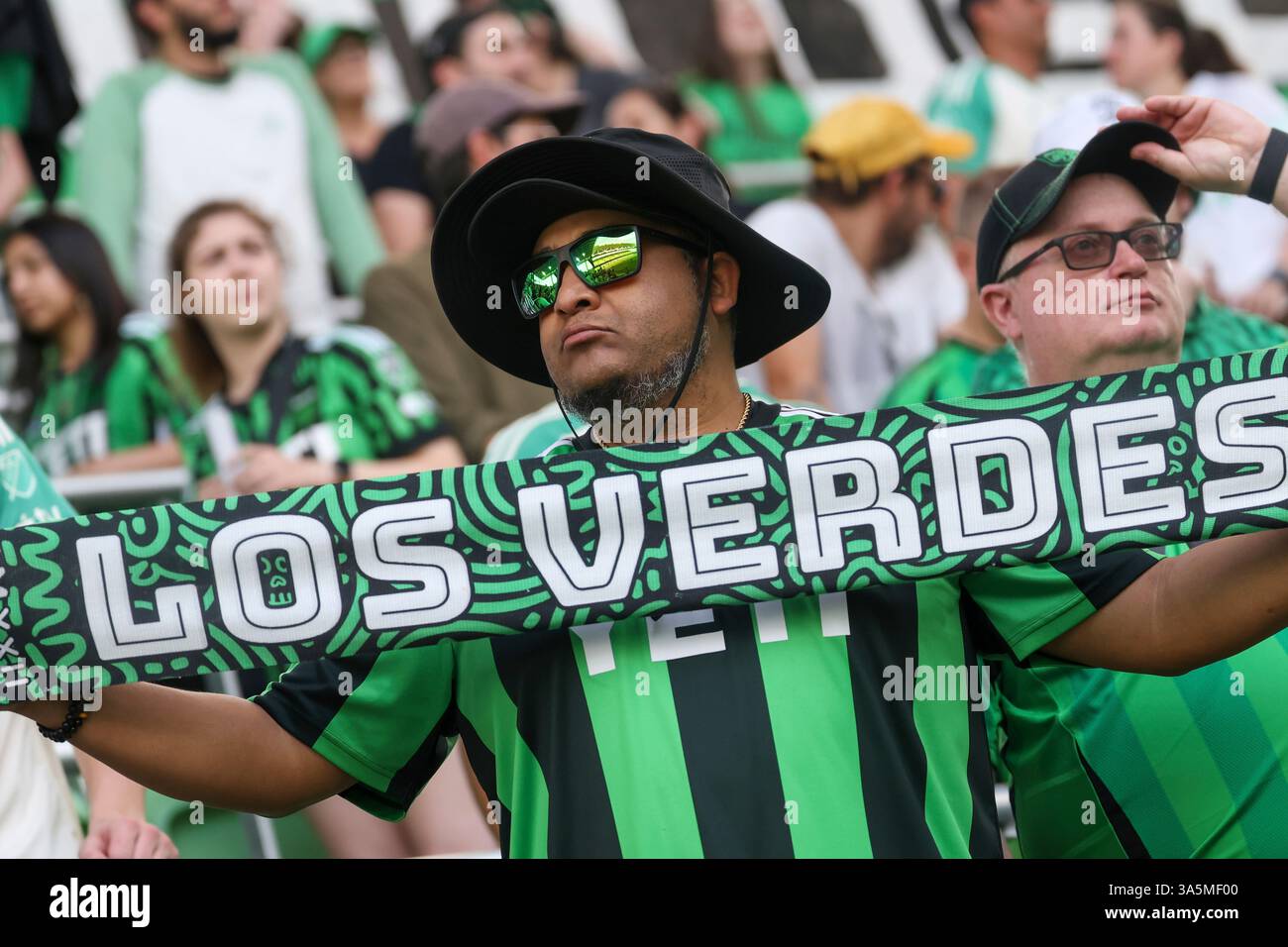 AUSTIN, TX - MARCH 23: An Austin FC supporter holds up a Los Verdes ...