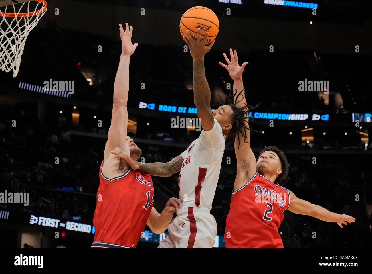 Alabama guard Labaron Philon (0) shoots between Saint Mary's center ...
