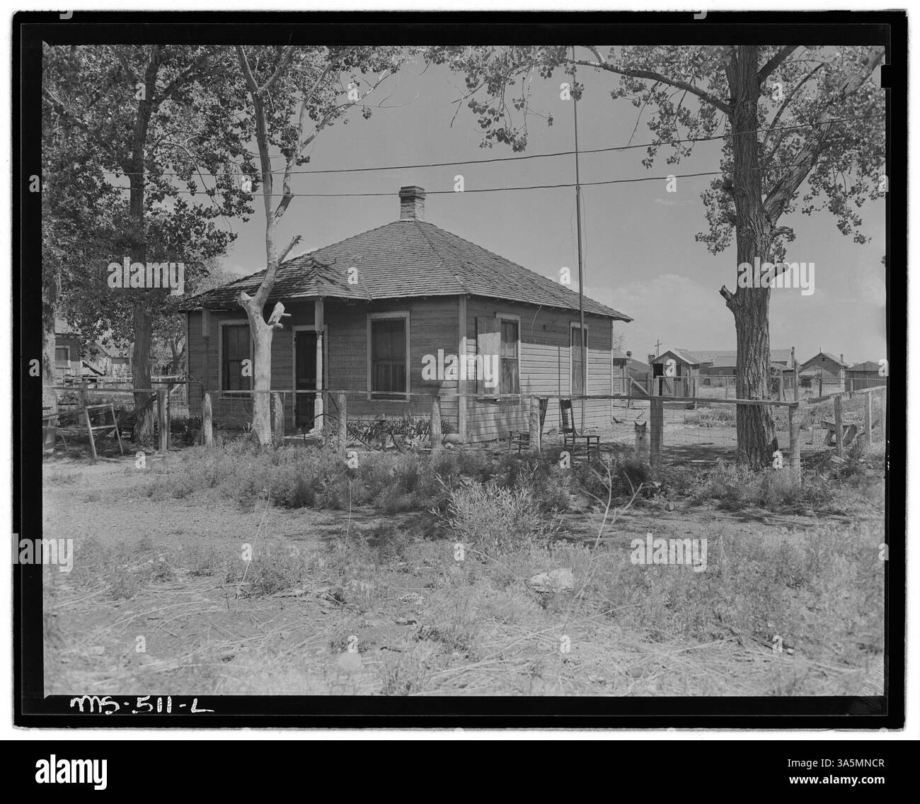 This photograph shows the home of a miner living in the company housing ...