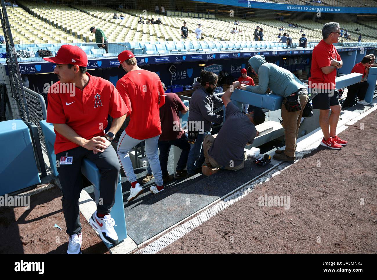 Workers put the finishing touches on the front of a dugout at Dodgers ...