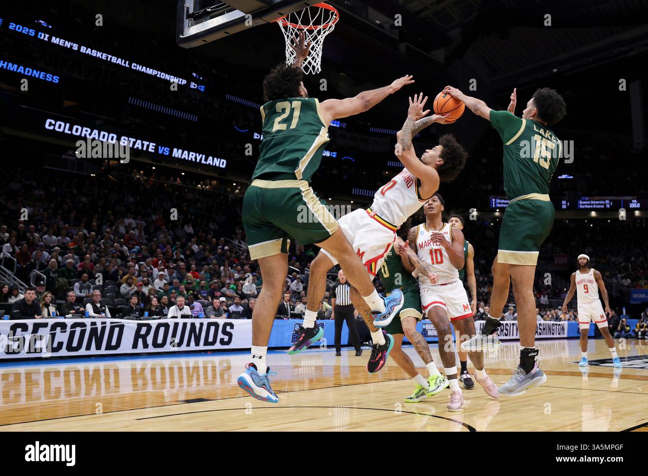 Maryland guard Ja'Kobi Gillespie, center, shoots against Colorado State ...