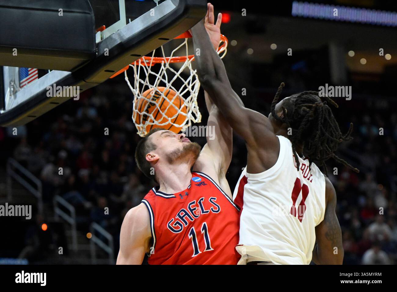 Alabama center Clifford Omoruyi, right, dunks beside Saint Mary's ...