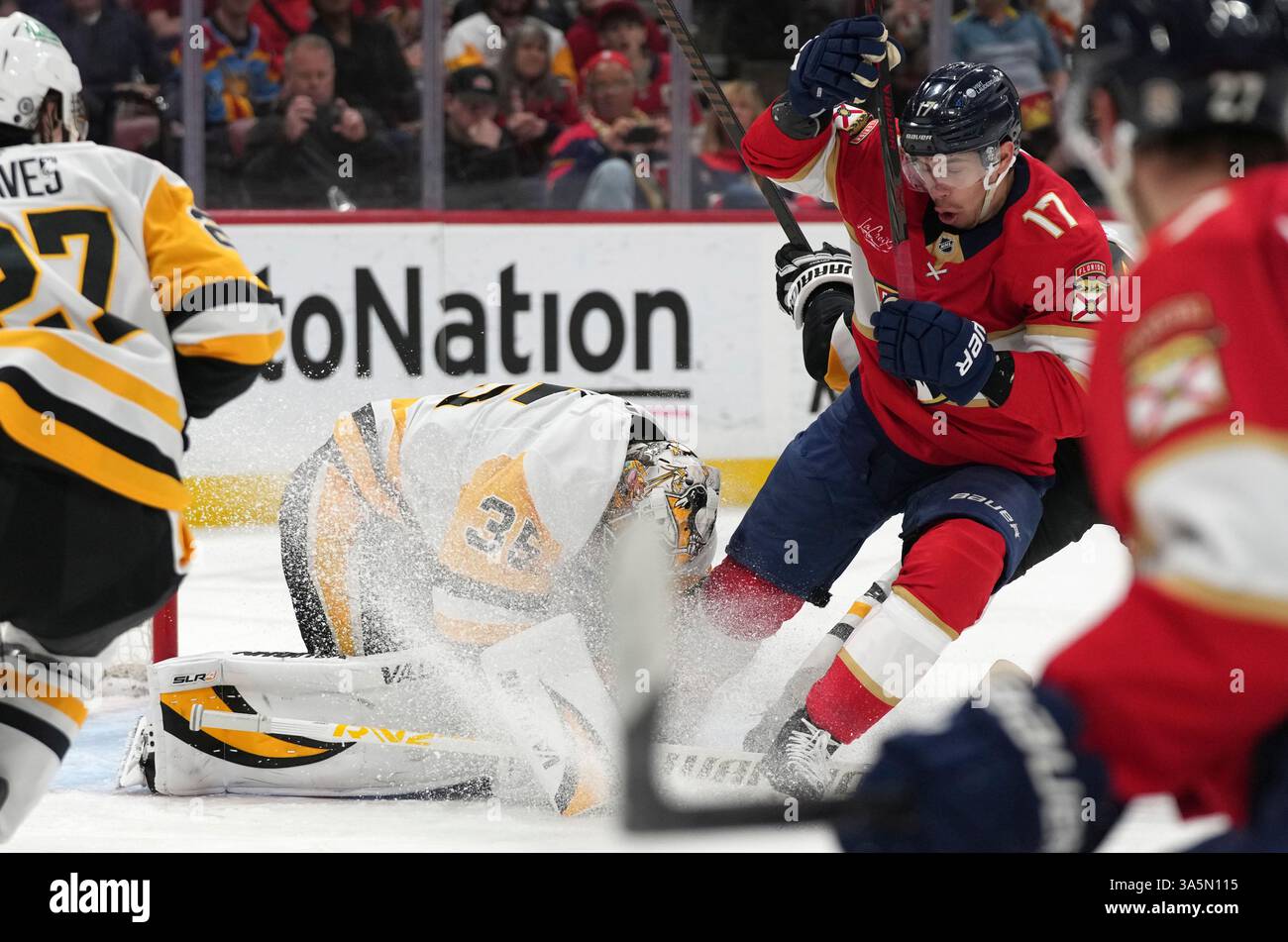 Florida Panthers center Evan Rodrigues (17) collides with Pittsburgh ...