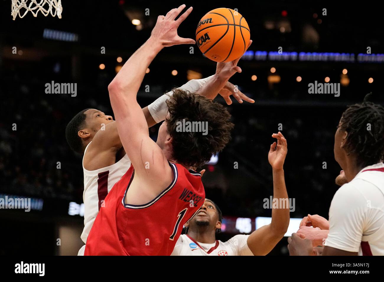 Alabama guard Chris Youngblood, left, knocks the ball away from Saint ...