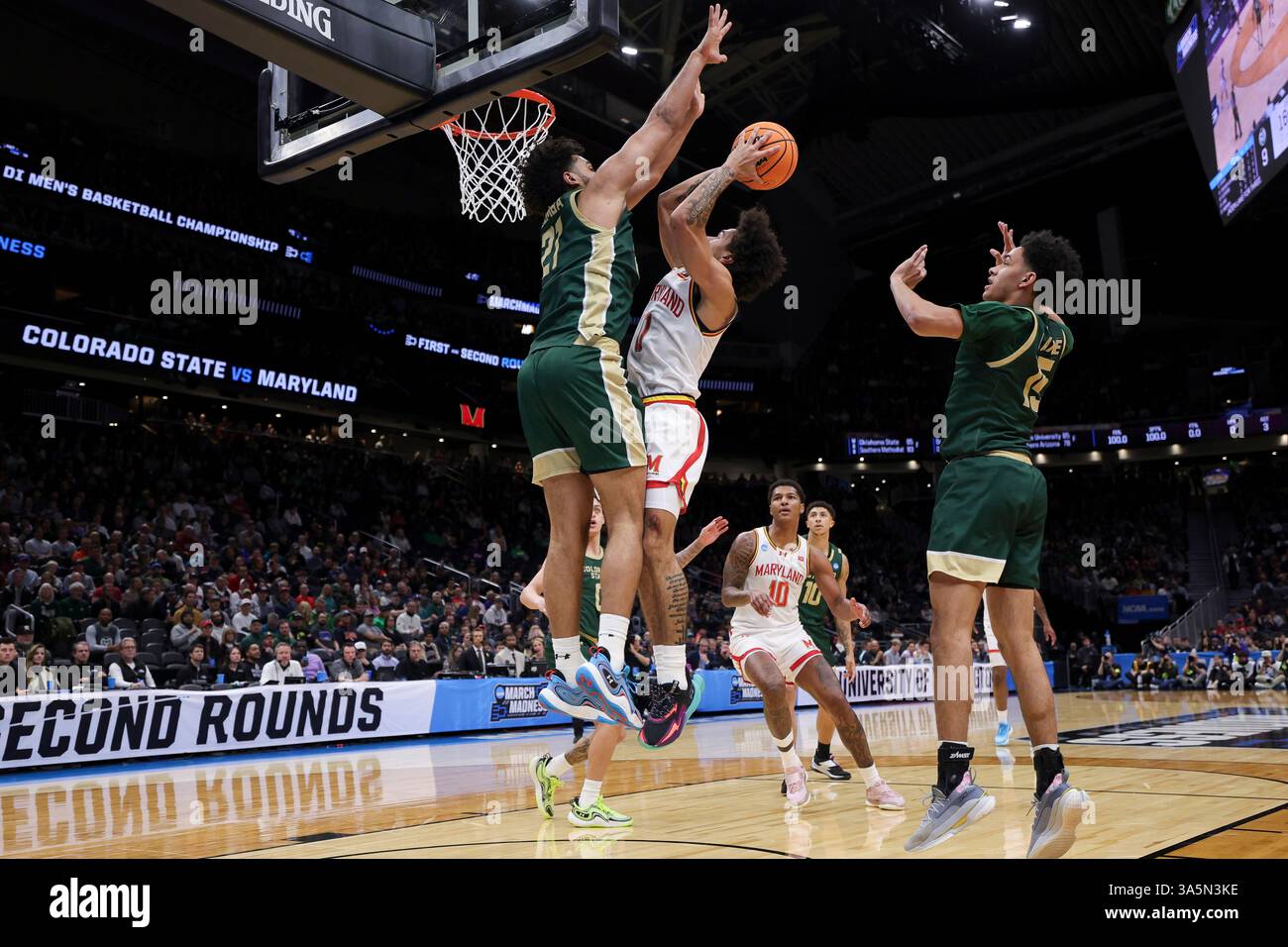Maryland guard Ja'Kobi Gillespie, center, shoots against Colorado State ...