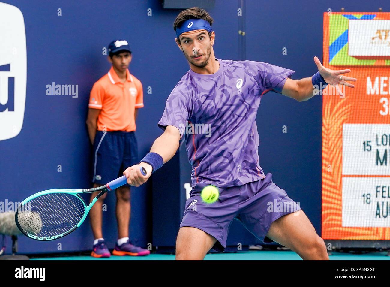 Miami, Florida, USA. 23rd Mar, 2025. Lorenzo Musetti (ITA) returns a shot to Felix Auger ...