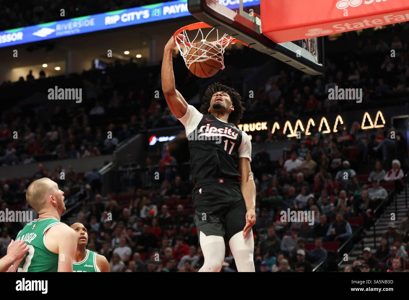 Portland Trail Blazers guard Shaedon Sharpe (17) dunks against the Boston Celtics during the ...