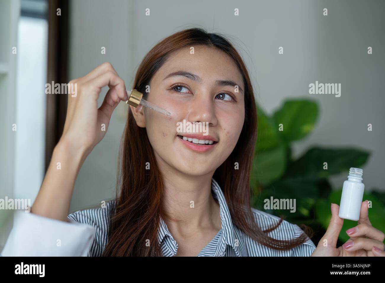 Facial Care and Beauty Essentials. A woman showcases her skincare and ...